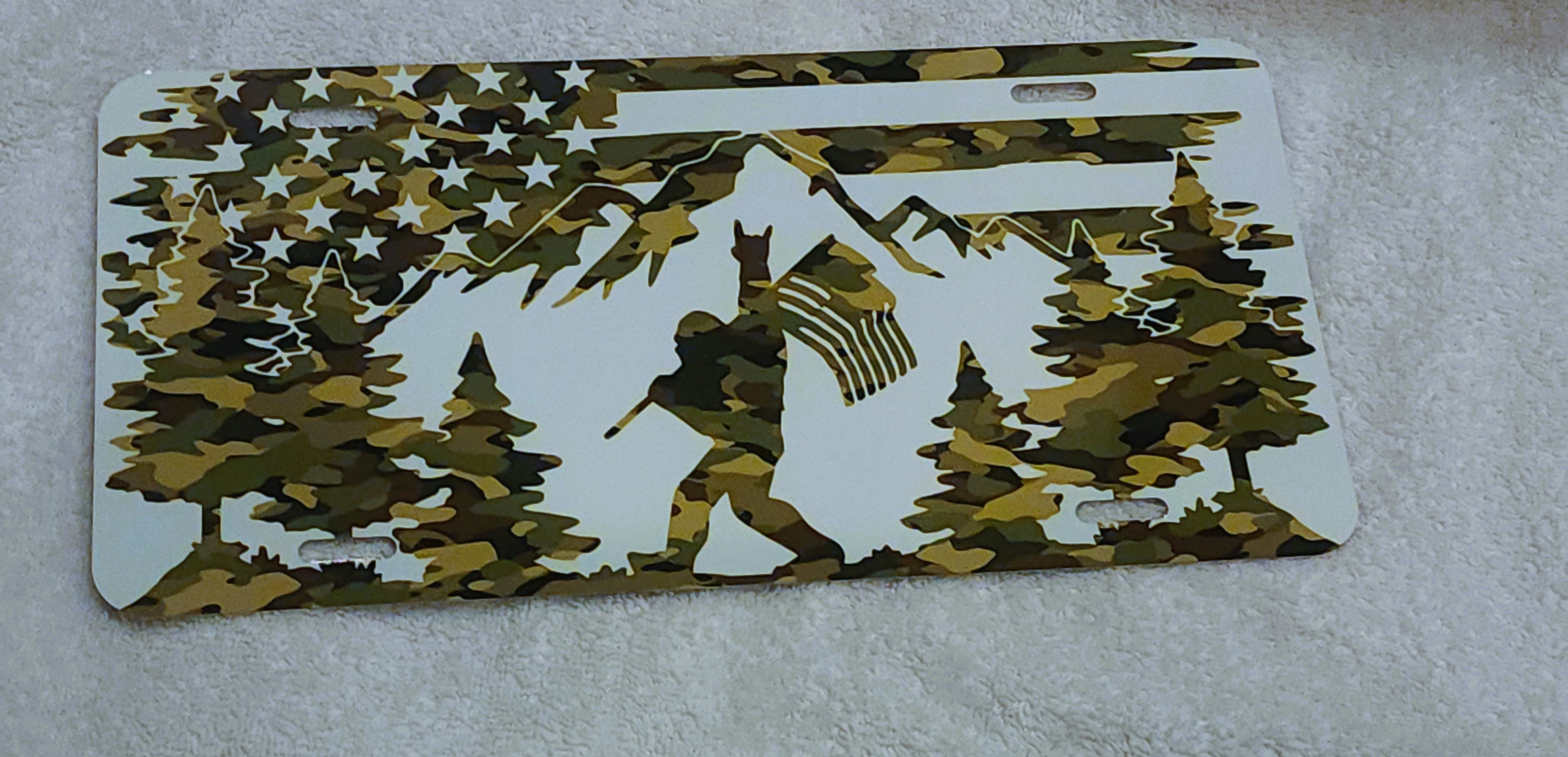 Sasquatch with a Flag and giving a Peace Sign License Plate – R&R ...